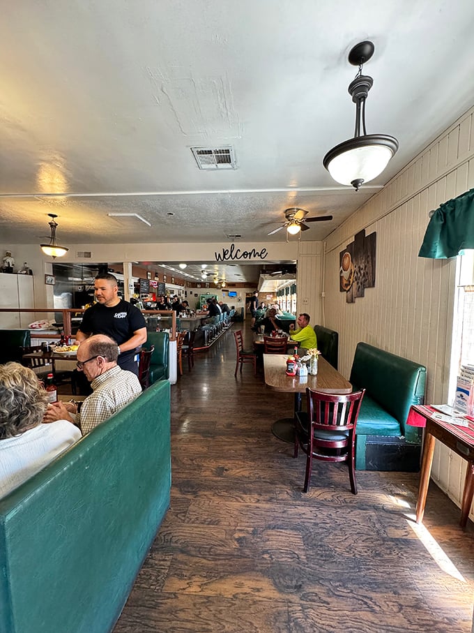 Step inside where green vinyl booths and vintage charm create the perfect backdrop for legendary comfort food experiences.