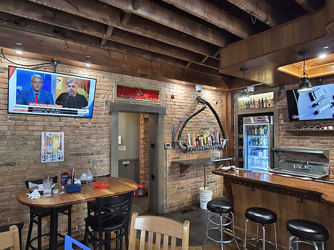 Exposed brick and wooden beams create the perfect backdrop for serious comfort food conversations.