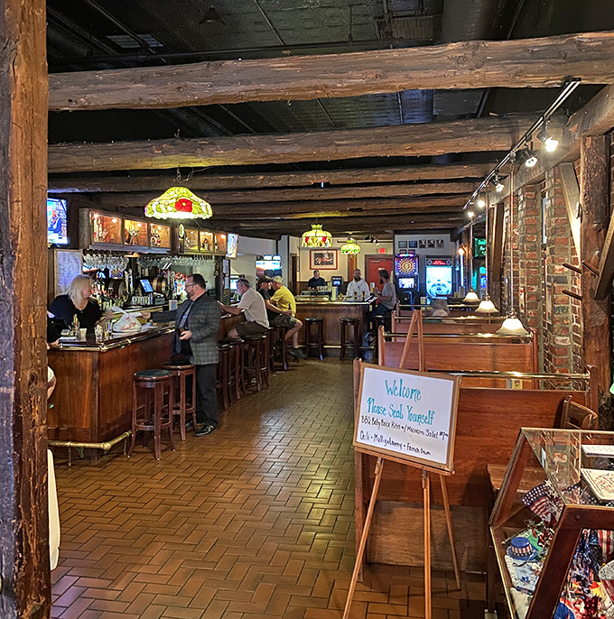 Step inside where exposed beams and warm lighting create the perfect atmosphere for serious wing consumption.