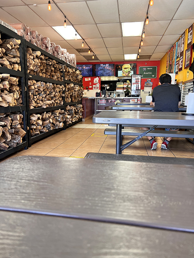 Inside, the wall of wood isn't decoration – it's fuel for flavor. This smoke arsenal powers the magic happening behind the scenes.