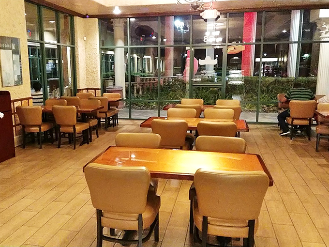 Inside, burgundy vinyl booths and festive string lights create that perfect time-capsule diner atmosphere where conversations flow as freely as the coffee.