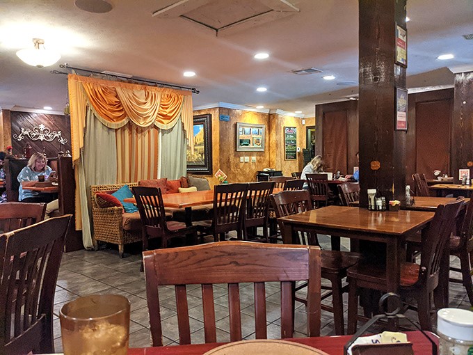 Step inside and the warm golden walls, draped fabrics, and wooden accents transport you from Mississippi to Marrakech faster than you can say "pass the pita."