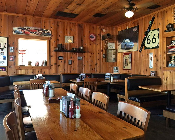 Wooden paneling that's witnessed decades of road stories creates the perfect backdrop for Route 66 memorabilia and "Cars" movie tributes.