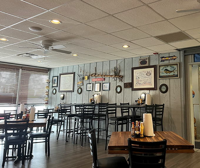 Weathered wood paneling and nautical decor transport you from Ohio to a coastal hideaway. No fake fishing nets here&mdash;just authentic maritime charm.