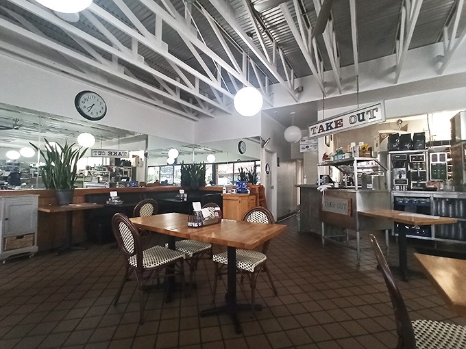 High ceilings, natural light, and bistro chairs create that rare space where time slows down just enough to savor every bite.