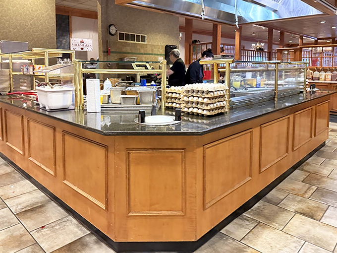 The buffet station's elegant wood paneling and marble countertops disguise what's really happening here: a joyful assault on your willpower.
