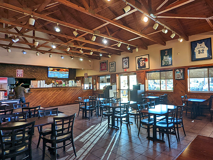Exposed beams and sports jerseys create the perfect no-nonsense atmosphere where sauce-stained shirts are badges of honor.