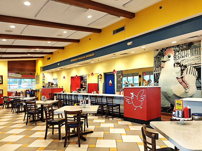 The interior's playful chicken theme and colorful decor create the perfect backdrop for serious comfort food consumption. That mural is pure Oviedo!