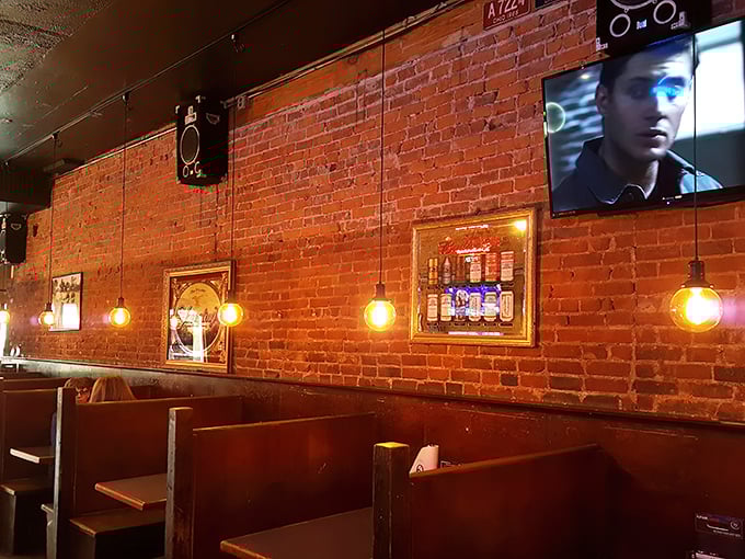 Exposed brick walls, warm lighting, and wooden booths create that perfect "I've found my new favorite spot" feeling the moment you walk in.