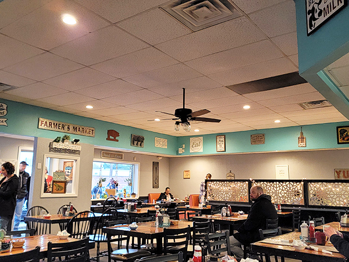 Turquoise walls and vintage decor create that perfect "grandma's kitchen meets cool diner" vibe where comfort reigns supreme and calories don't count. 