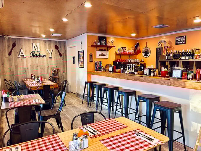 Step inside and you're transported to a cozy French bistro, complete with checkered tablecloths and rustic wooden accents that whisper, "Stay awhile, mon ami."