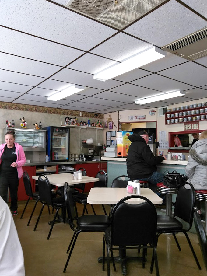 Inside, time stands still in the best possible way. Disney figurines watch over diners while the counter offers front-row seats to breakfast magic.