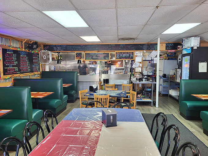 Green vinyl booths and no-nonsense tables set the stage for serious eating. This isn't Instagram decor&mdash;it's a temple of smoke.