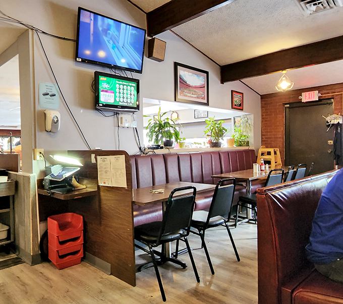 Burgundy vinyl booths and wood paneling create the perfect time capsule where calories don't count and nobody's checking their phone.