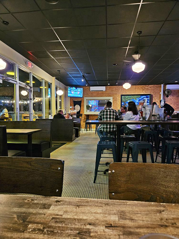 The interior strikes that perfect balance between "neighborhood joint" and "serious food destination." Wood, metal, and the promise of deliciousness.