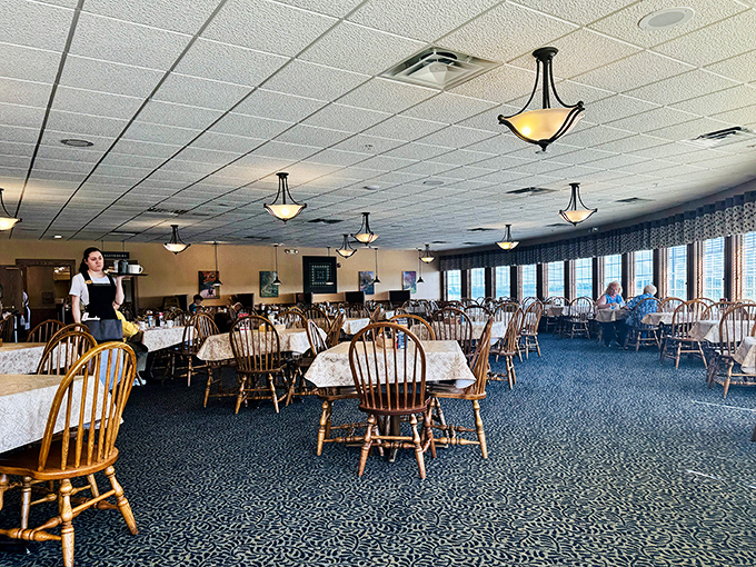 Step inside to a dining room where wooden chairs and simple tablecloths set the stage for extraordinary meals. The spacious interior offers comfort without pretension.