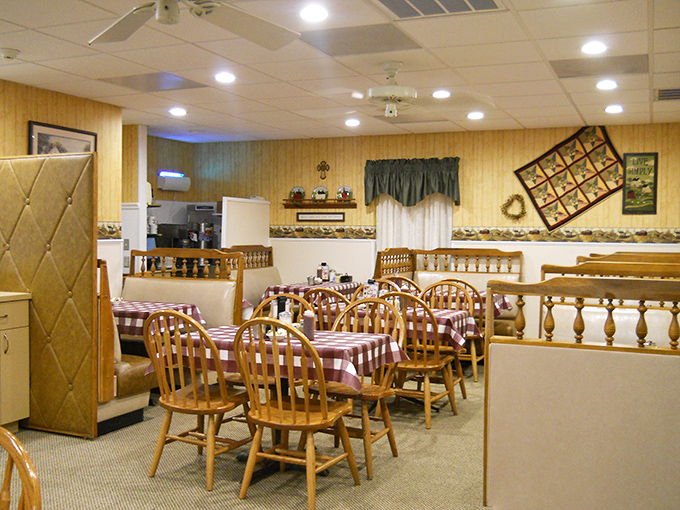 Step into a time machine disguised as a dining room. Those wooden chairs and checkered tablecloths aren't just furniture&mdash;they're promises of comfort food to come.