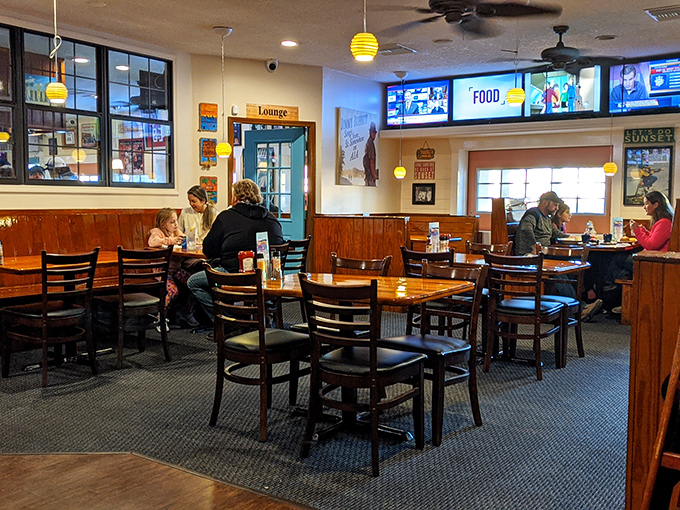 Inside, warm wood paneling and yellow pendant lights create that perfect "come as you are" atmosphere where flip-flops meet fantastic food without pretension.