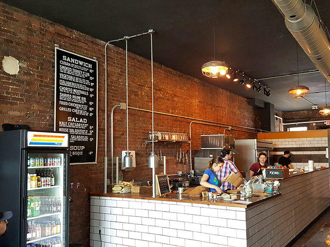 Industrial chic meets sandwich artistry in this temple of taste. The menu board reads like poetry to the perpetually hungry.