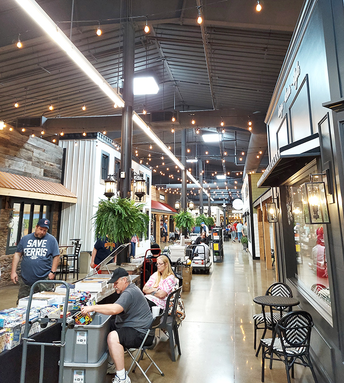 String lights cast a warm glow over vendors and shoppers alike, creating the perfect atmosphere for discovering your next conversation piece.