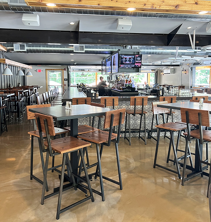 Industrial meets cozy in this thoughtfully designed interior where polished concrete floors and wooden tables create the perfect backdrop for culinary adventures.