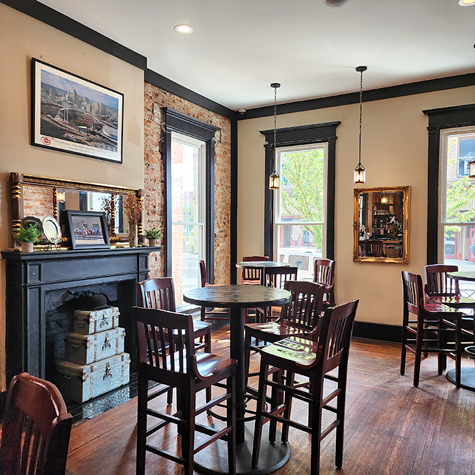 Exposed brick meets warm wood in this cozy dining space where the fireplace suggests you should settle in and stay awhile.