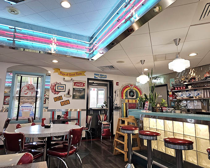 Neon dreams and chrome gleams&mdash;the interior's aqua and red color scheme hits that perfect sweet spot between authentic and Instagram-worthy.