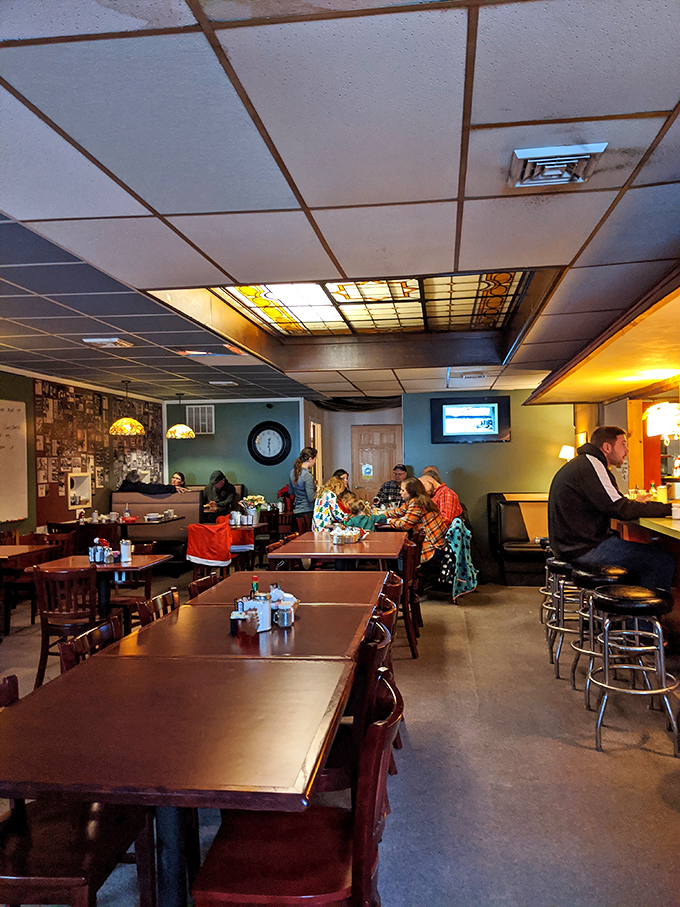 Inside, time slows down under the warm glow of stained glass ceiling panels, where conversations flow as freely as the coffee.