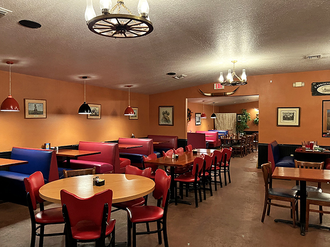 Wagon wheel chandeliers, terracotta walls, and red vinyl chairs&mdash;this isn't interior design, it's a time machine to when steakhouses meant business.