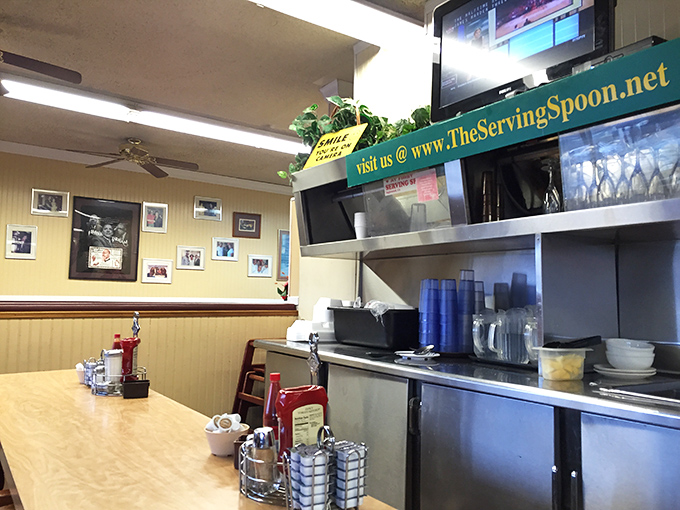 Yellow walls adorned with framed memories create that perfect "grandma's kitchen" vibe. Comfort begins before the food even arrives.