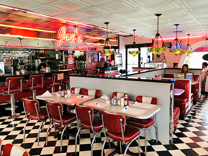 Classic red vinyl booths, checkerboard floors, and neon lighting &ndash; this isn't just a diner, it's a time machine with table service.