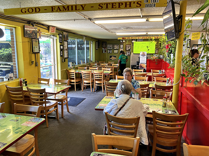 "God - Family - Steph's" hangs prominently above diners, establishing the holy trinity of priorities. The cheerful yellow walls feel like a warm embrace before the food even arrives.