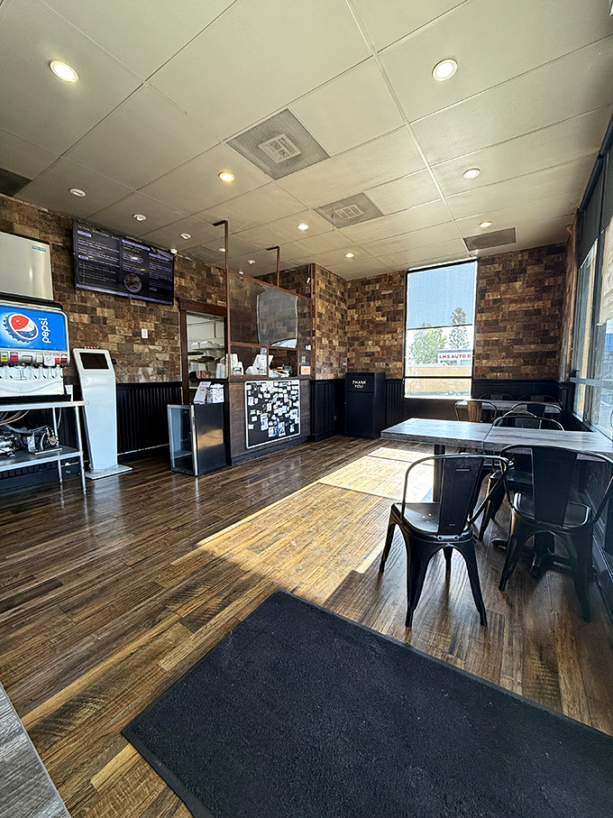 No-nonsense brick walls and simple tables prove great burgers don't need fancy decorations to shine.