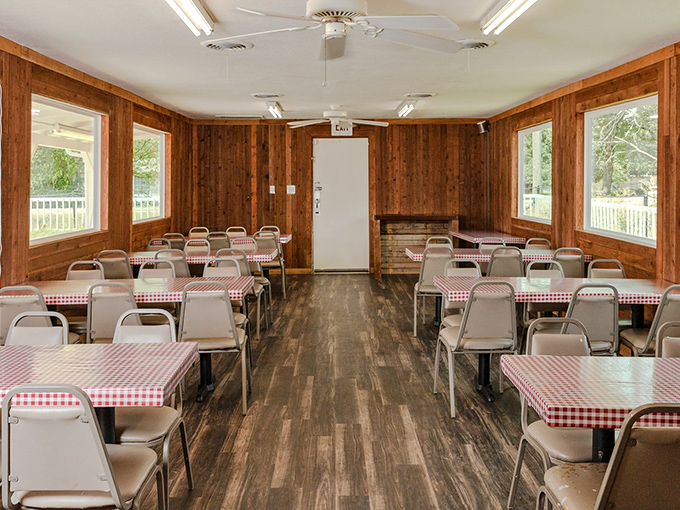 Wood-paneled walls and red checkered tablecloths create the perfect barbecue sanctuary for serious eating.