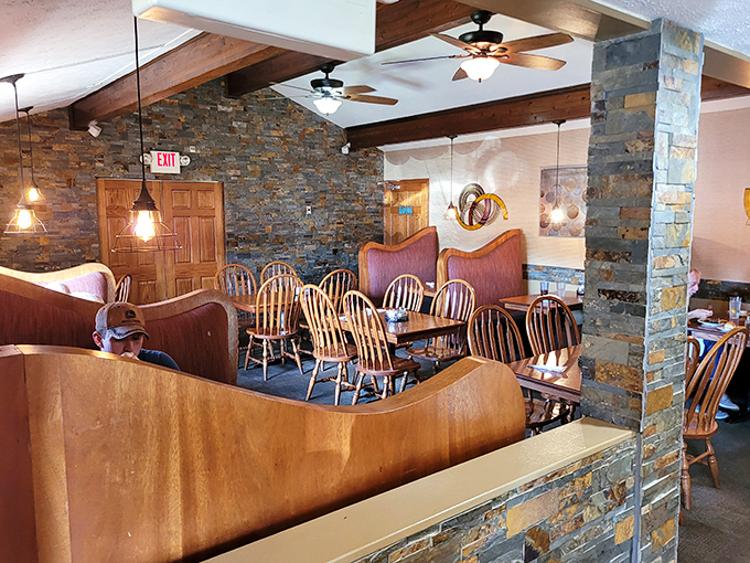 Stone walls and wooden booths create that rare dining atmosphere where conversations flow as easily as the coffee.