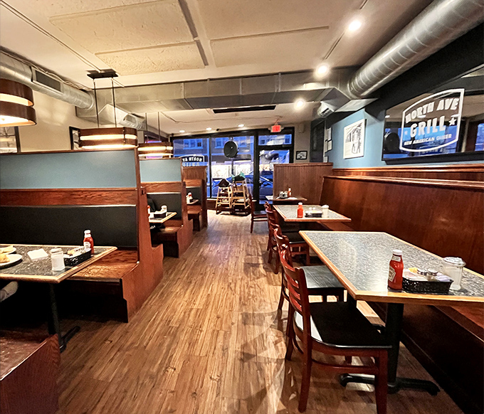 Wooden booths, blue walls, and exposed ductwork create the perfect backdrop for comfort food magic. Like your favorite jeans, but with better hash browns.