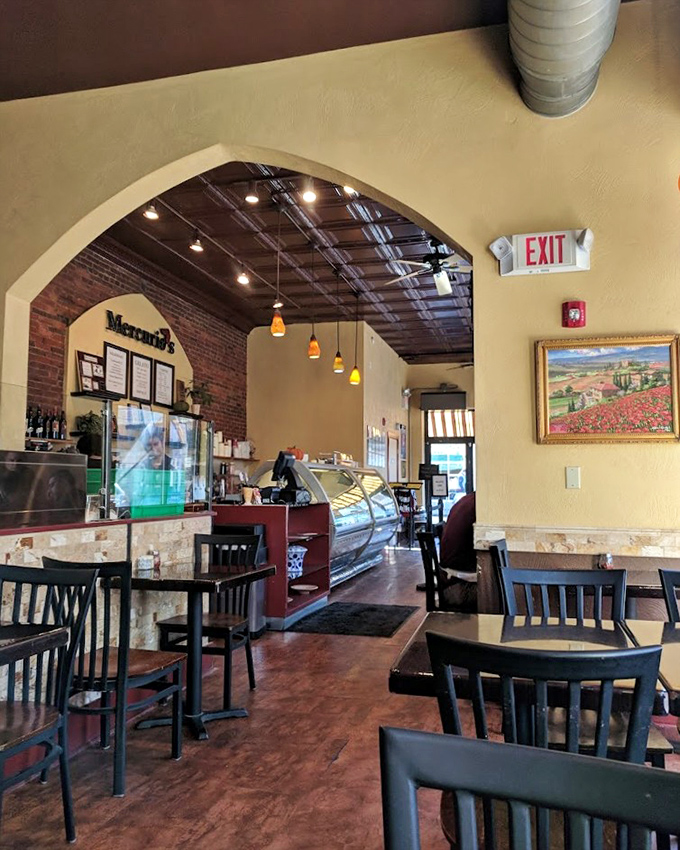Step inside and the warm yellow walls, exposed brick, and that gorgeous archway instantly transport you from Pittsburgh to a cozy trattoria in Naples.