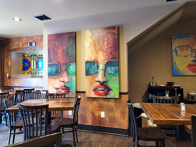Bold artwork transforms dining into an experience. These colorful wall portraits watch over your meal like friendly, sunglasses-wearing guardians.