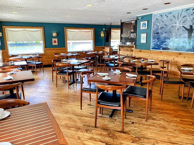 Inside, teal walls meet honey-colored wood paneling, creating that perfect "upscale casual" vibe where both flip-flops and fancy shoes feel equally at home.