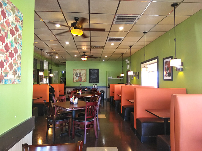 Lime green walls and cozy orange booths create the perfect backdrop for morning philosophy discussions or simply savoring that first life-giving sip of coffee.