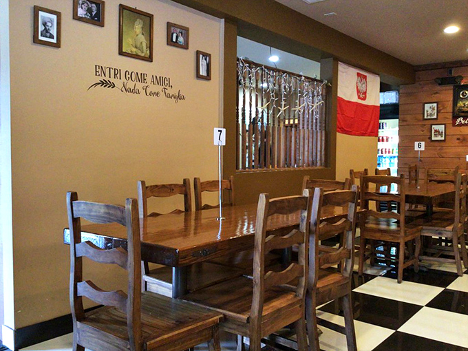 Entri Come Amici (Enter as Friends) proclaims the wall, and with that checkered floor and Polish flag, you're practically family before the first bite.