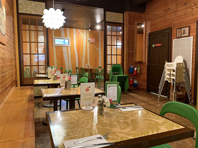 Warm wooden walls meet playful green chairs in a dining room that feels like your coolest friend's living room&mdash;if that friend were a culinary genius.