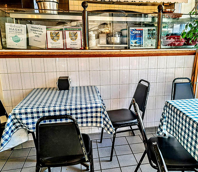 Simple blue checkered tablecloths and no-nonsense seating tell you everything you need to know&mdash;this place prioritizes substance over style, just as it should.