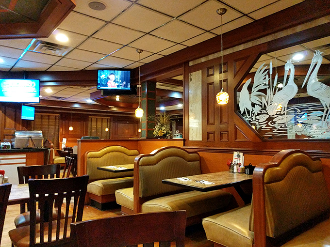 Wood paneling, pendant lights, and those impossibly comfortable booths &ndash; the holy trinity of proper diner design. Even the etched glass birds seem to say "stay awhile."