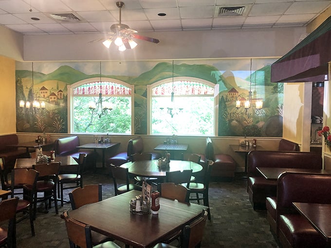 Step inside and you're transported to a cozy dining room where the hand-painted murals make you feel like you're dining in a countryside train car.