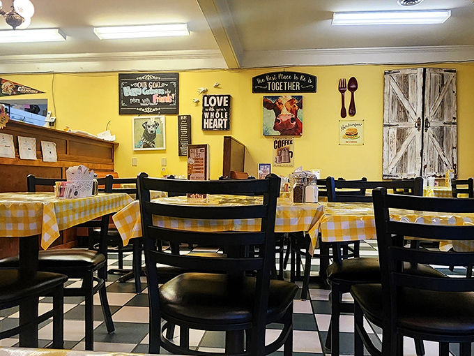 Sunshine-yellow walls and checkered tablecloths create the kind of cheerful atmosphere that makes even Monday mornings bearable.