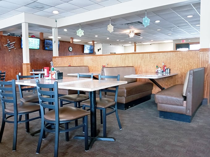 Classic wood paneling and comfortable booths create that perfect diner atmosphere where conversations flow as freely as the coffee.