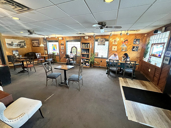 Wood-paneled walls and mismatched furniture create the perfect "grandma's living room meets coffee shop" vibe we didn't know we needed.