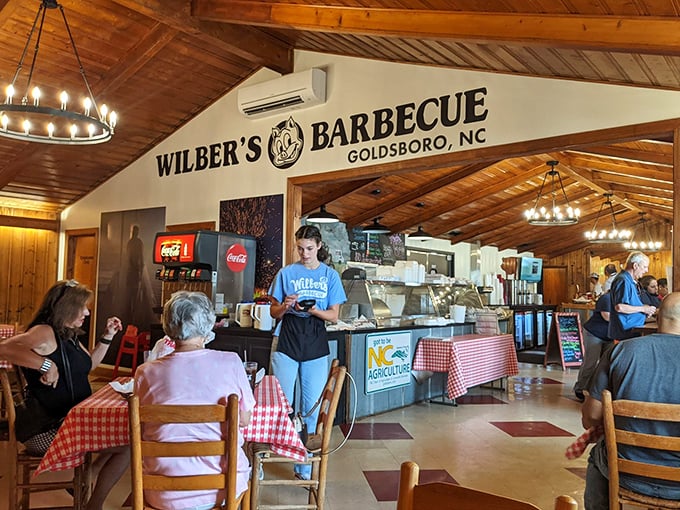 Wooden beams, circular chandeliers, and checkered tablecloths&mdash;the holy trinity of authentic barbecue ambiance. Time stands deliciously still at Wilber's.