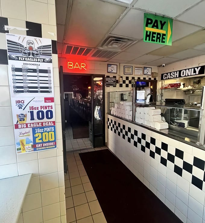 Step inside and the black-and-white checkered counter tells you everything: this is old-school Philly, where cash is king and cheesesteaks are royalty.